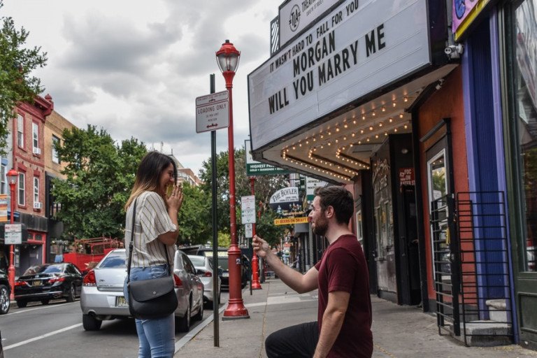 A Surprise Proposal at the TLA Was Perfect for This Concert-Loving Pair